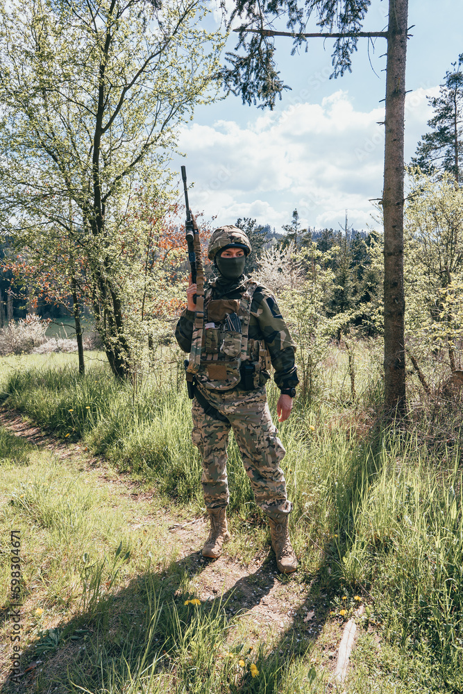 A member of a special unit. A soldier with an assault rifle in his hand ...