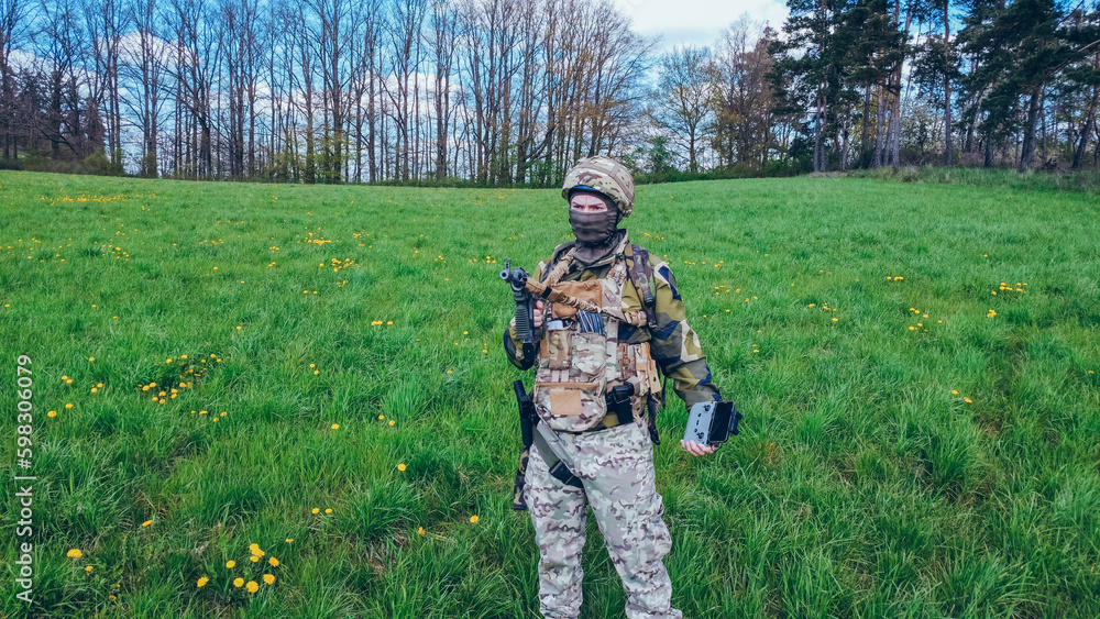 Modern army soldiers using aerial drone for artillery guidance and ...