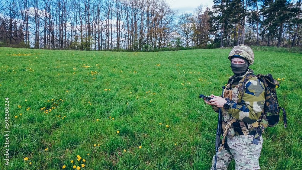 Modern army soldiers using aerial drone for artillery guidance and ...
