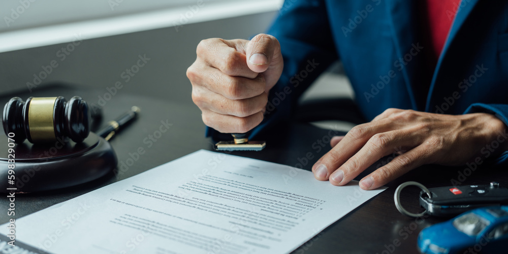 Car insurance agent consulting with policy and contract to approved ...