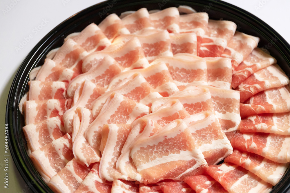 Premium slices Kurobuta (Black Pig) pork with high-marbled texture on ...