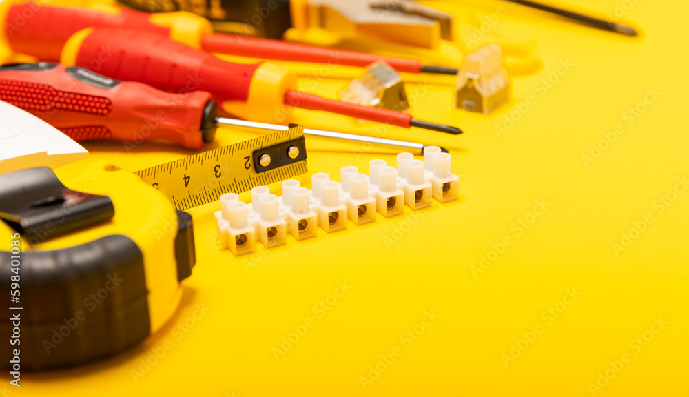 Electrician equipment on yellow background with copy space.Top view ...