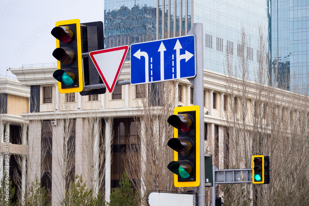 Traffic management. Green permissive traffic light sign and lane signs ...