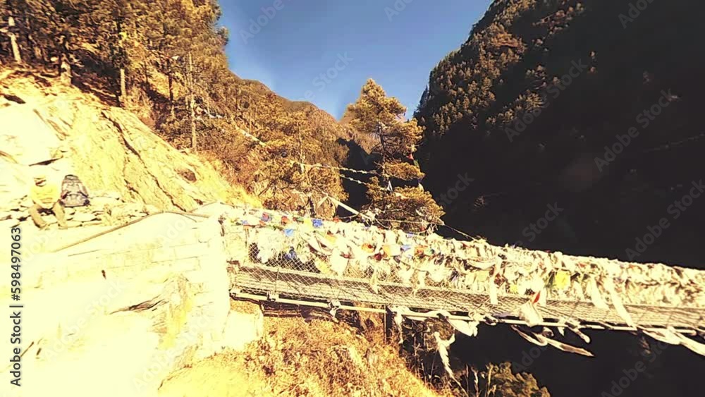 Largest suspension bridge in Khumbu valley with colorful Tibetan prayer ...