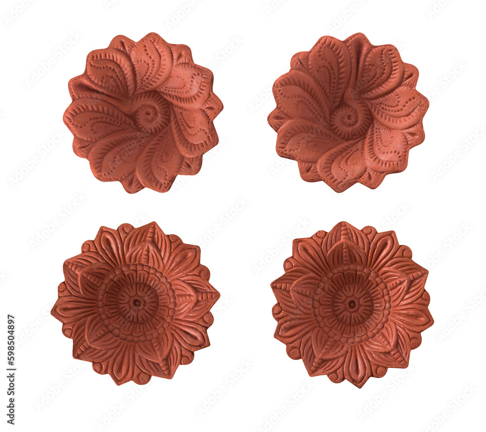 Indian festive clay lamps with floral designs isolated on white ...