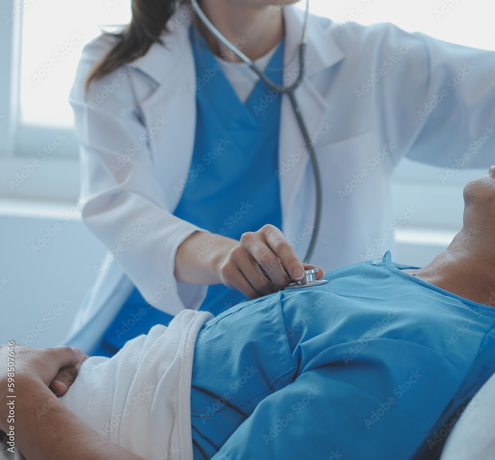 Injured patient showing doctor broken wrist and arm with bandage in ...