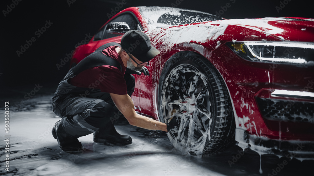 Red Sportscar's Wheels Covered in Shampoo Being Rubbed by a Soft Sponge ...