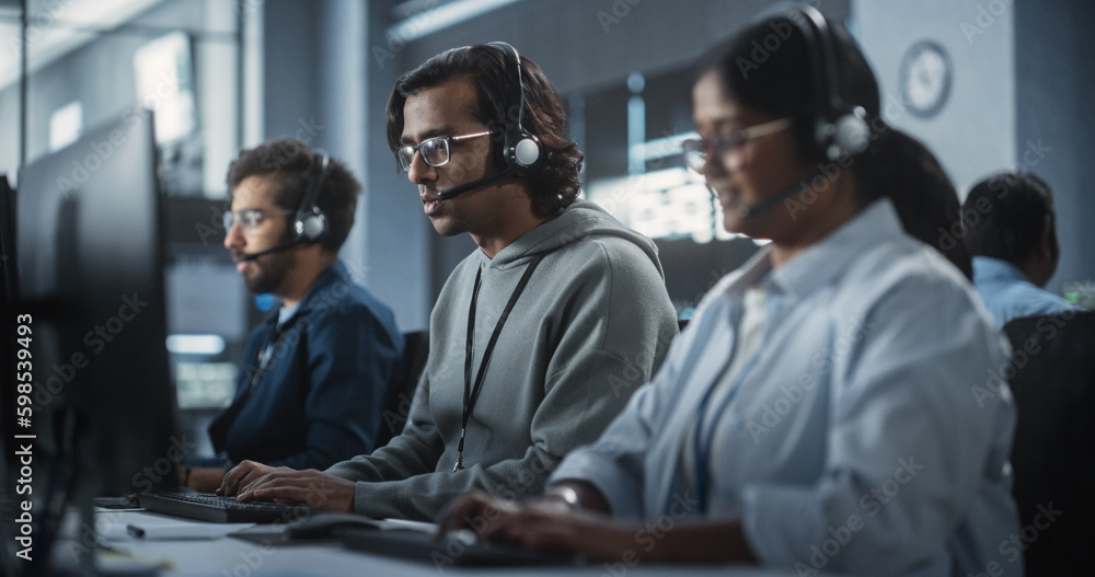 Indian Customer Support Team Using Computers and Talking with Clients ...
