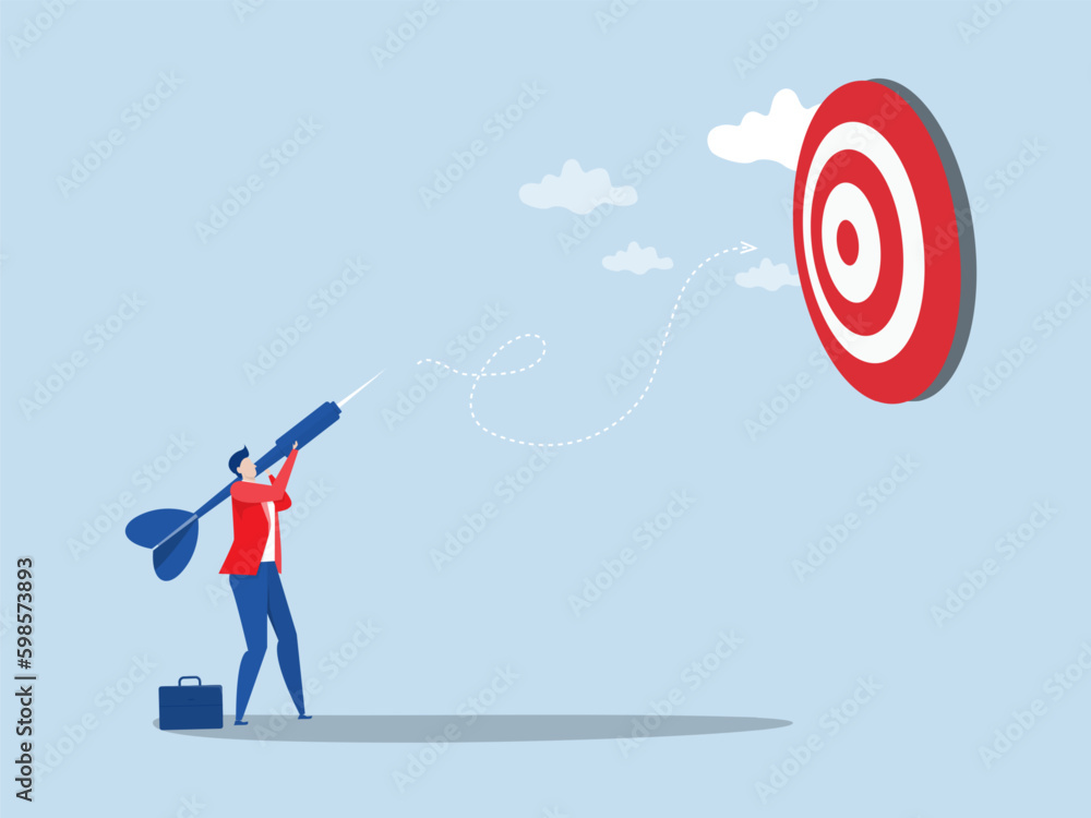 achieve target concept ,businessman holding dart to target bullseye to ...