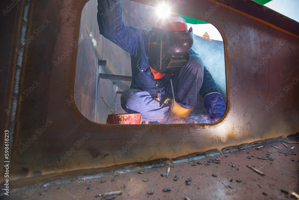 Male worker wearing protective clothing and repair pontoon manhole ...