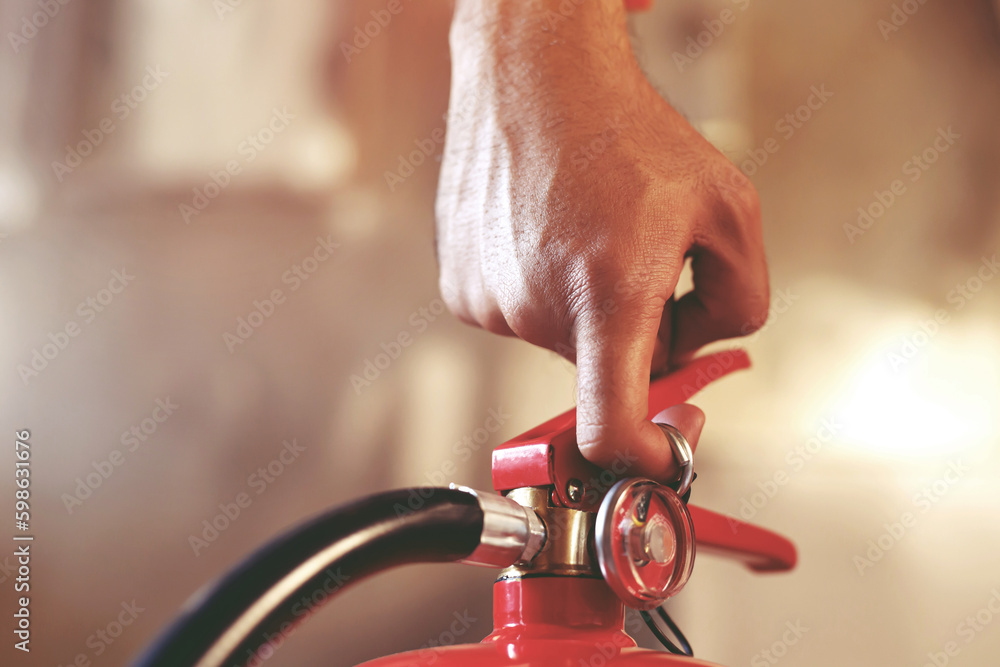 hand presses the trigger fire extinguisher available in fire ...