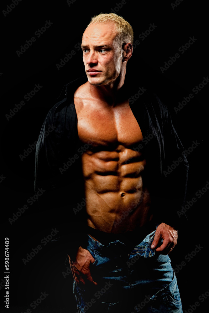Bodybuilder Wearing Black Shirt showing amazing Six Pack abs Stock ...