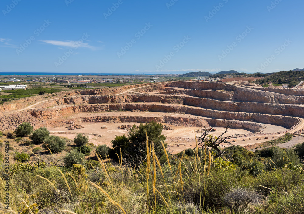 Open pit mining in Spain, Xilxes mountains. Chalk and Dolomite development in quarry. Mining ...