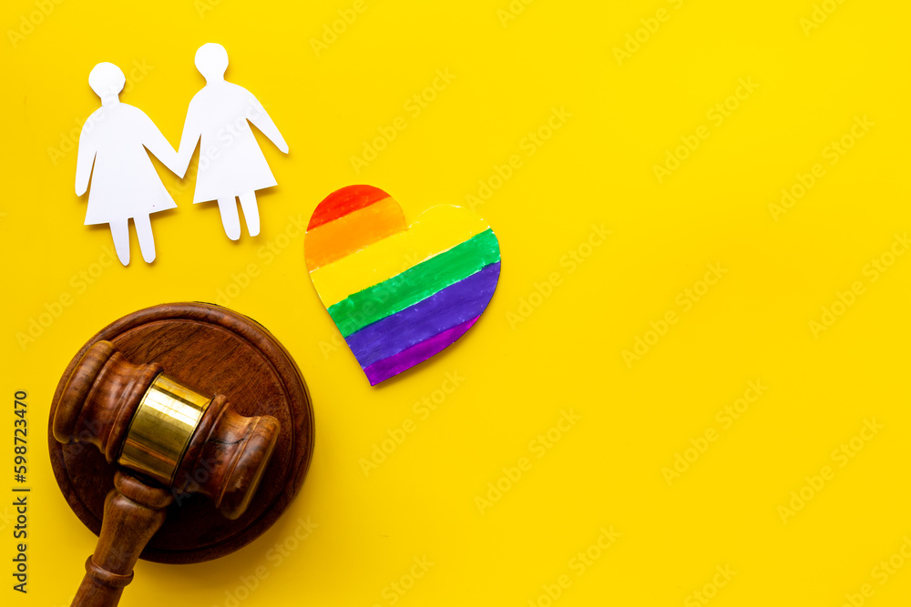 LGBT couple - two women paper shapes with judges gavel. LGBT social ...