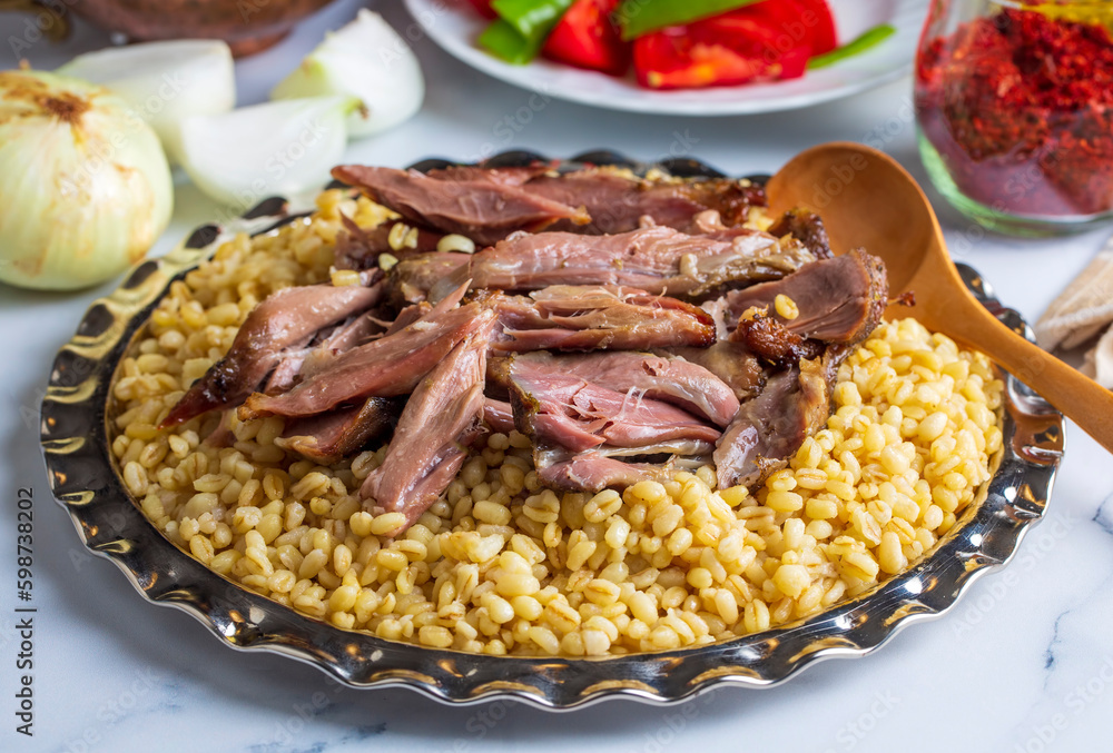 Turkish foods; lamb shank tandoori on bulgur wheat rice (Turkish name ...