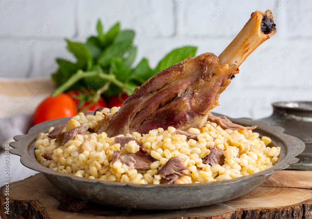 Turkish foods; lamb shank tandoori on bulgur wheat rice (Turkish name ...