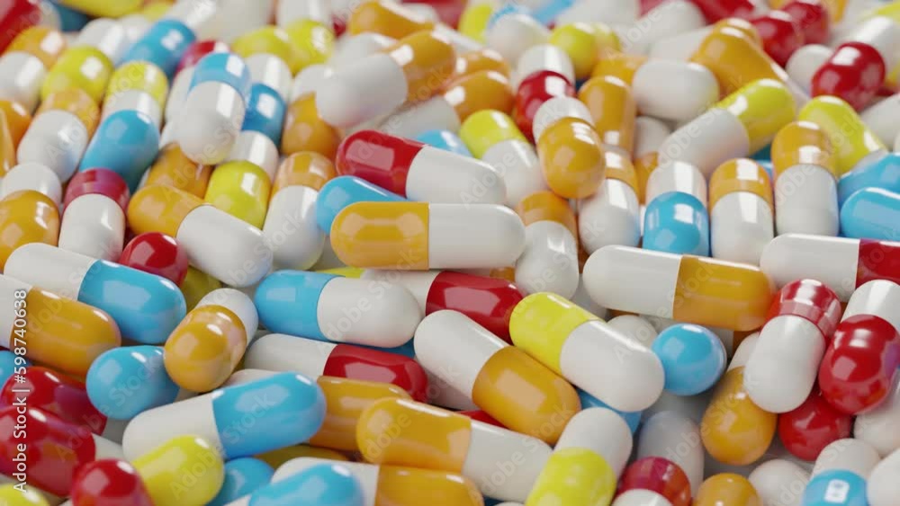 Many colorful capsule pills spin around. View from the top 3D render ...