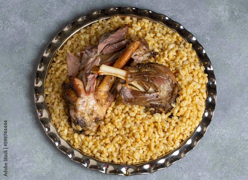 Turkish foods; lamb shank tandoori on bulgur wheat rice (Turkish name ...