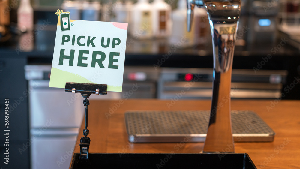 "Pick up here", the self service banner sign at the food reastaurant or ...
