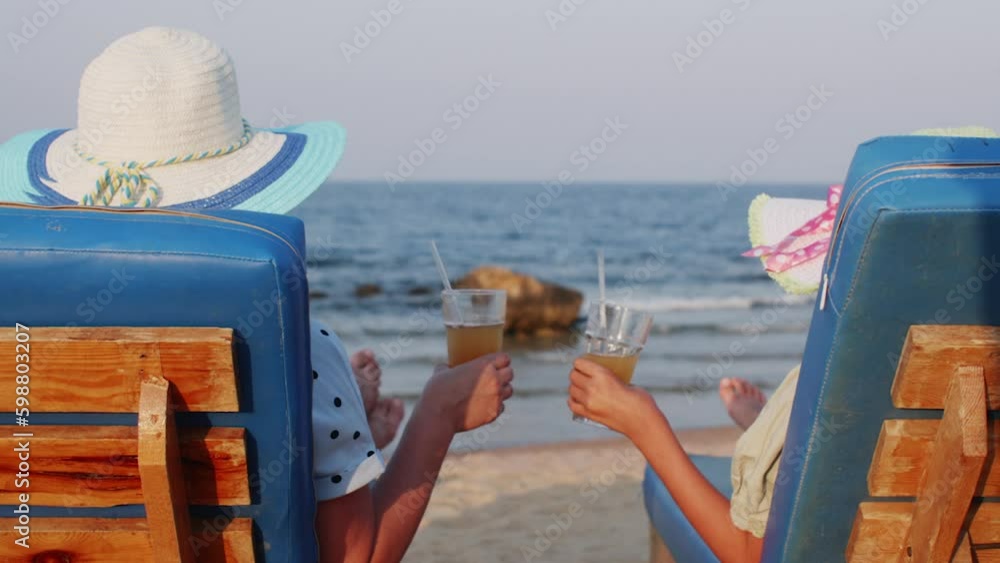 Women Relax Sit In Sunbeds Drink Cocktails In Summer Holidays On Ocean