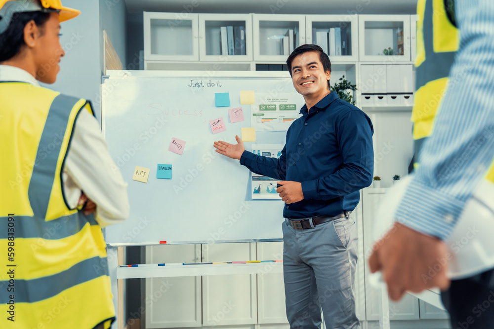 Entrepreneur brainstorming ideas with his competent engineers in the ...