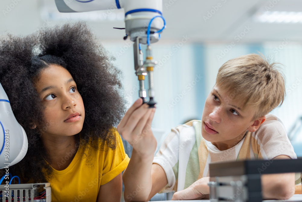 Group Kid teen child enjoy Machine Learning Robot arm is Moving Under ...