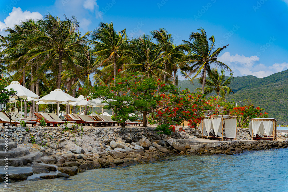 Beach holidays. Dam Bay on an island near Nha Trang in Vietnam. Tourist ...