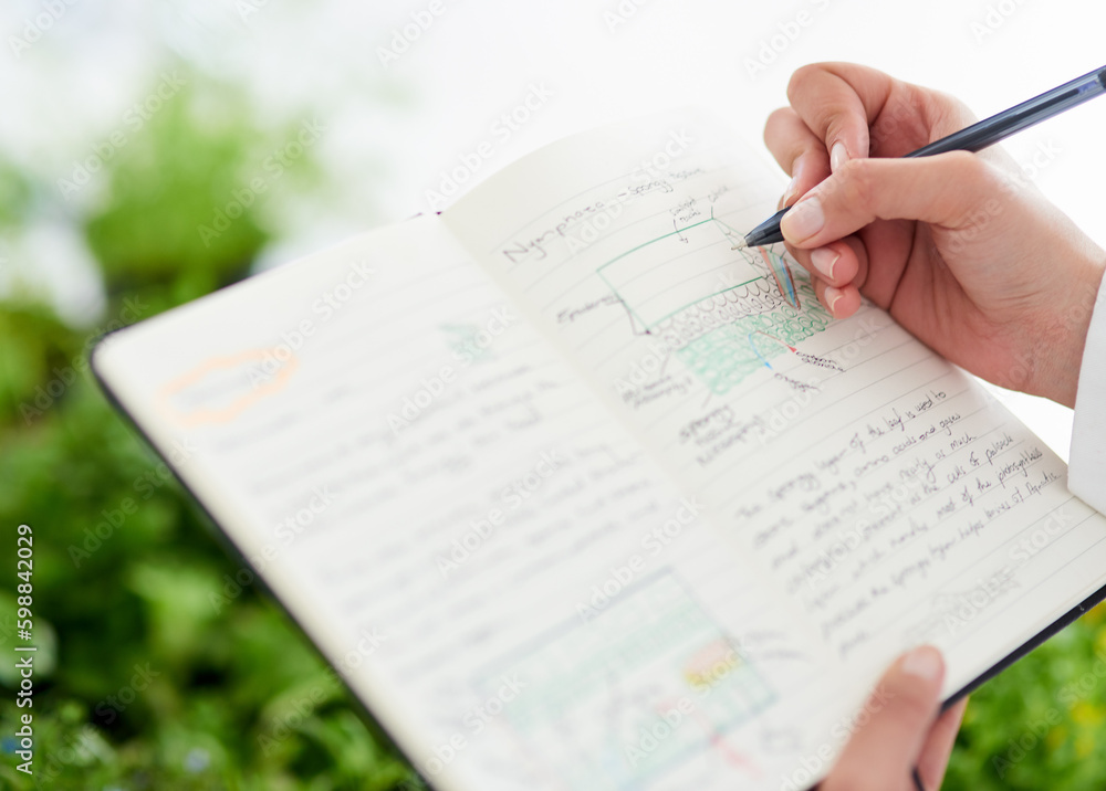 Noting down some vital observations. Closeup shot of an unrecognisable ...