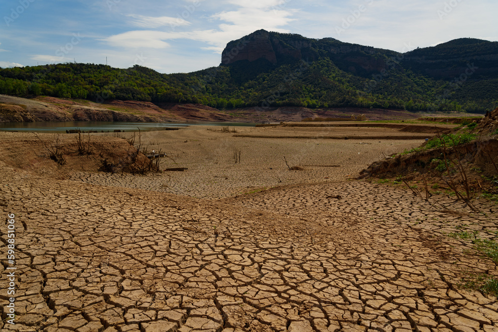 Scorched earth and earth clods are seen on dry land caused by drought ...