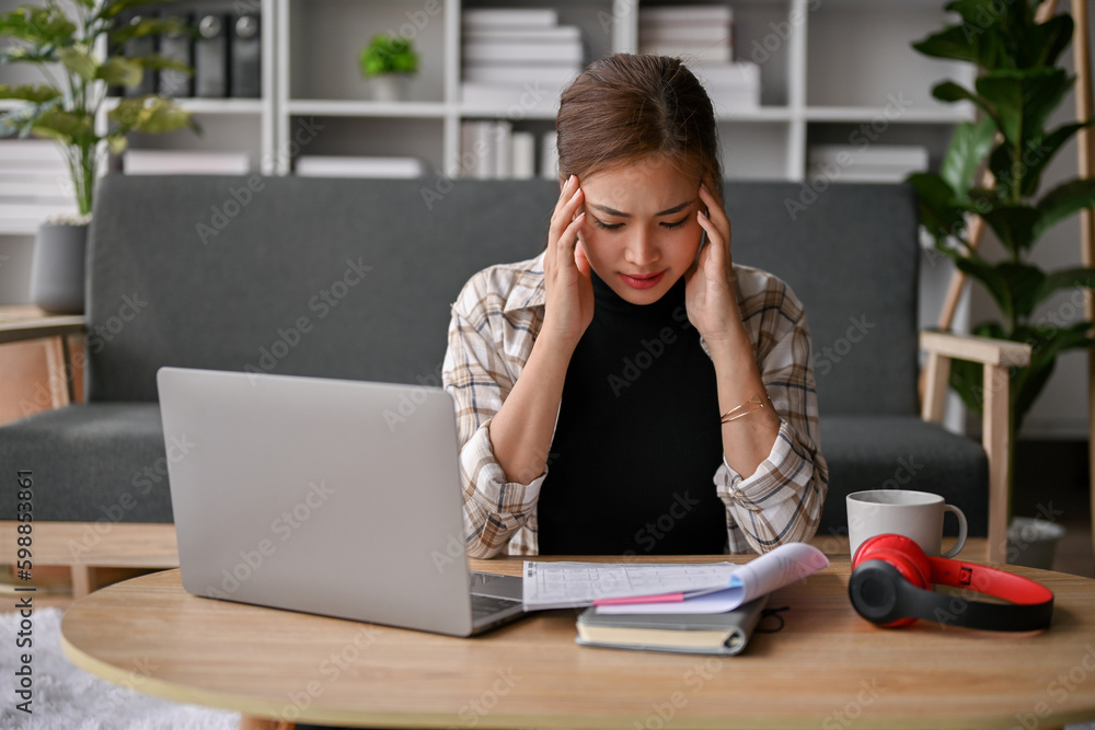 Stressed young Asian female college student preparing for the exam in ...