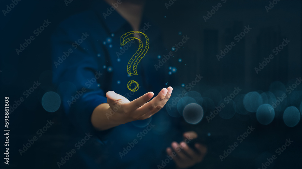 Businessman hand holding question mark on blurred background Or The ...
