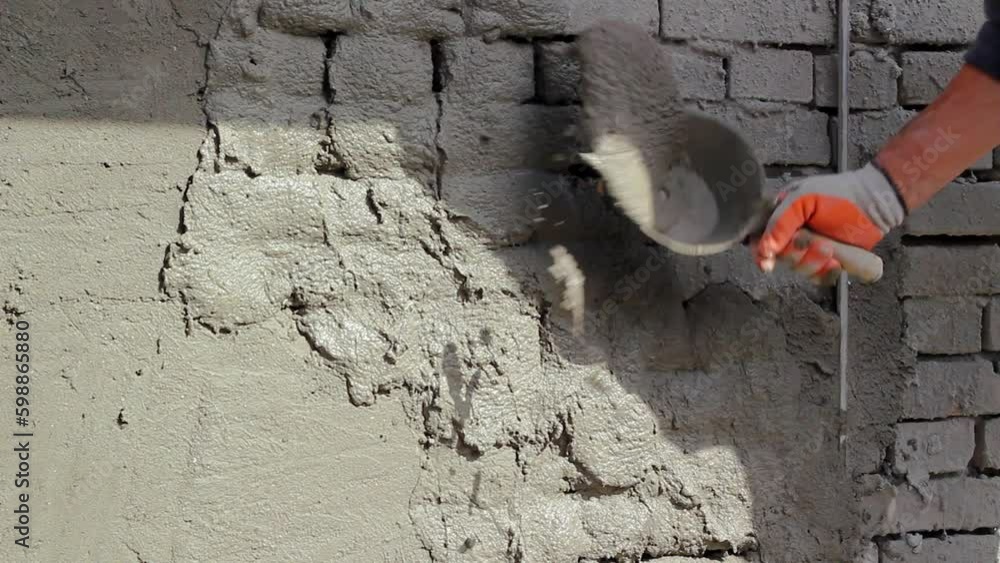 Applying Plaster on External Brick Wall. Construction Mason Worker ...