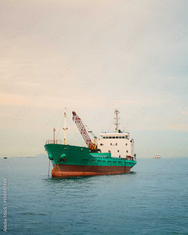 Cargo ship in the middle of the sea at the border between Indonesia and ...