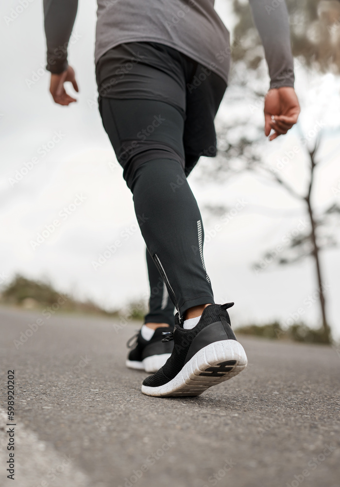 Change happens with one step at a time. an unrecognizable man hiking ...