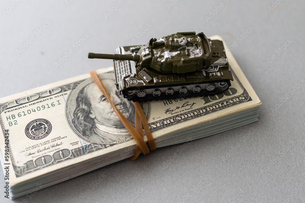 toy tank on the background of dollar bills. Generative AI Stock Photo ...