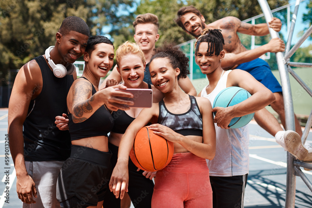 Gather around for a team selfie. a group of sporty young people taking ...