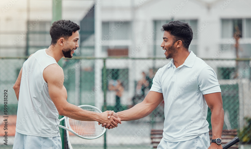 Two ethnic tennis players shaking hands before playing court game ...