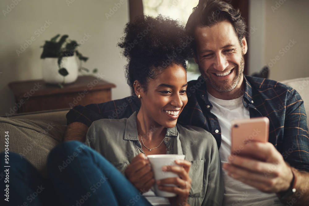 Look at these messages with me. a happy young couple using a cellphone ...