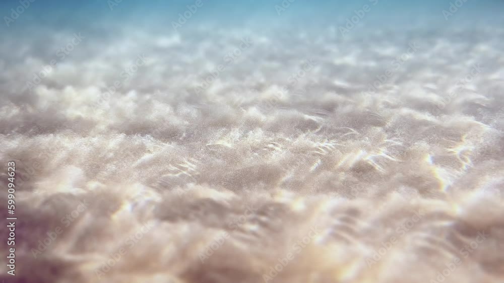 Underwater sandy sea bottom. Water Waves Mixing the yellow sand ...