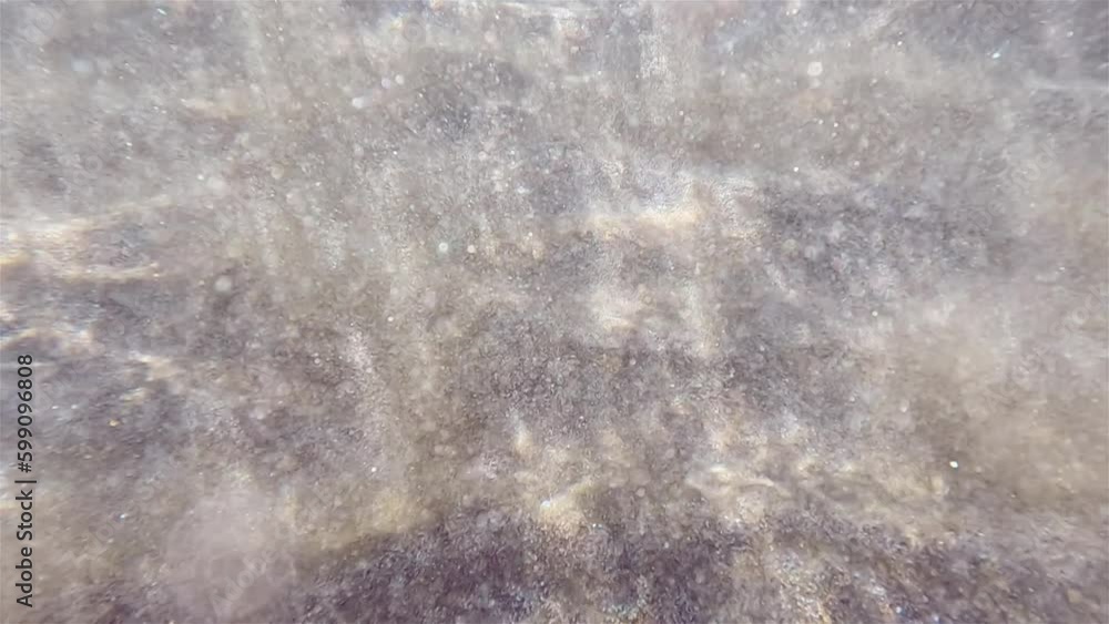 Underwater sandy sea bottom. Water Waves Mixing the white sand. Stretch ...