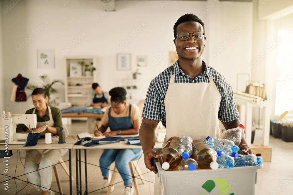 African american designer holding a recycling bin. Businessman holding ...