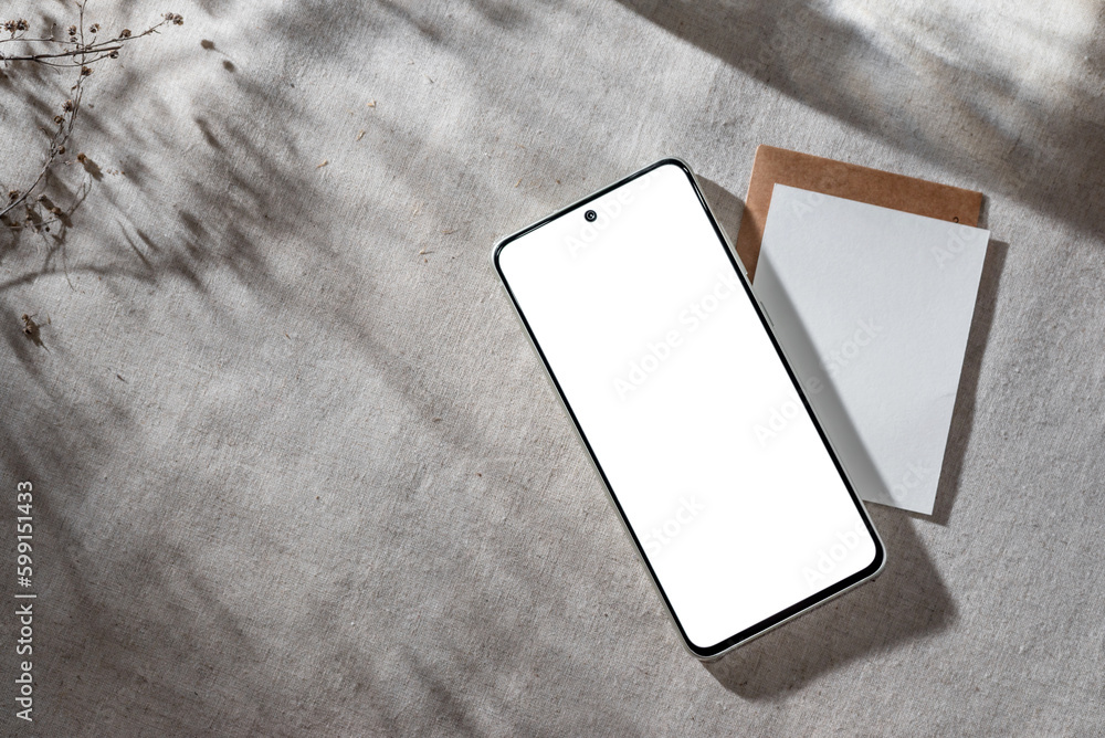 Mobile phone with empty screen mock up on neutral beige linen ...