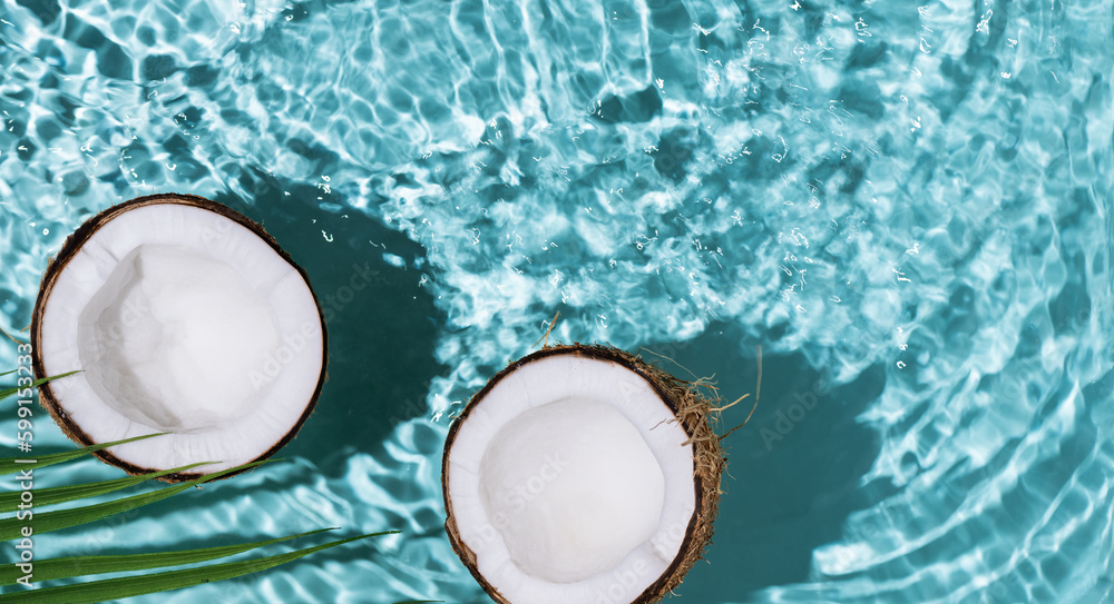 Summer background with coconuts on water background with water splashes ...