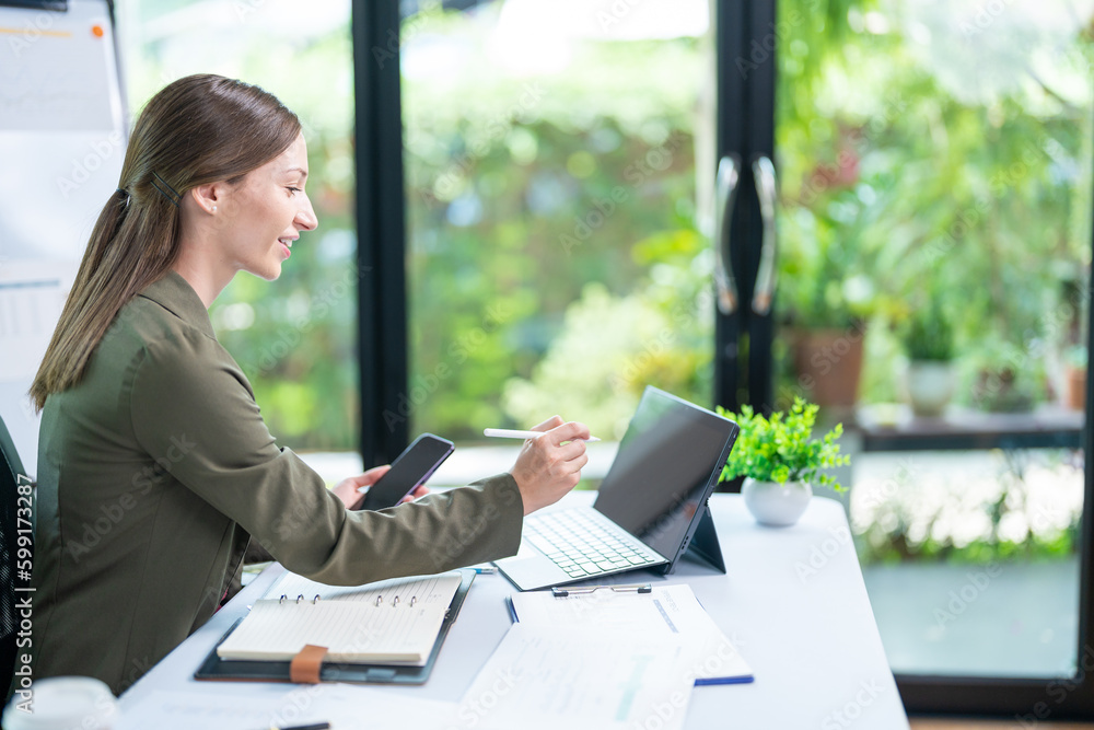 Young successful employee business woman 20s in casual shirt sit work ...