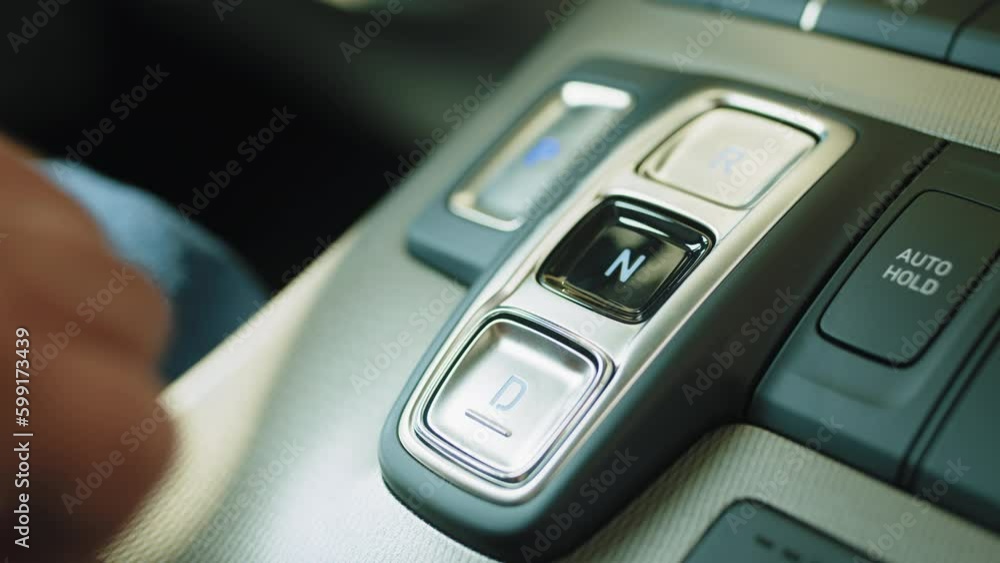 Starting car engine. Track in to the button. Finger press the button to ...