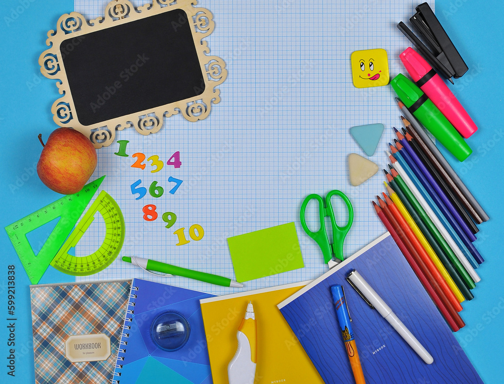 Colorful school supplies ,fresh apple ,small blackboard top view on ...