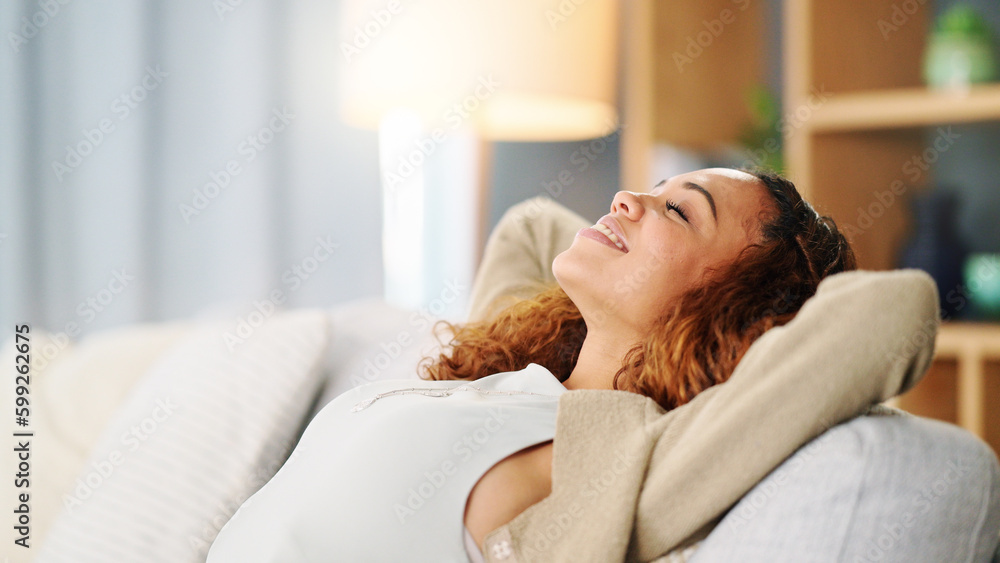 Woman, relax and hands behind head on sofa, living room and lounge for ...