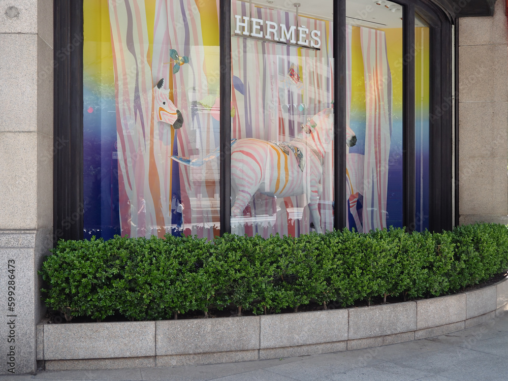 TOKYO, JAPAN - May 4, 2023: Hermes store display in a window of ...
