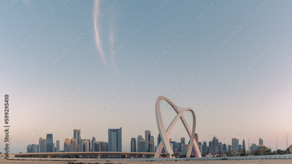 Doha skyline at sunset of light blue and yellow colored sky, Middle ...