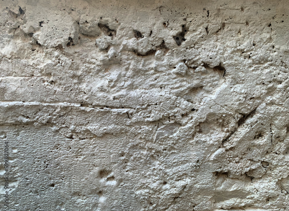 Surface of old cement plaster painted white. Closeup of grunge rough ...